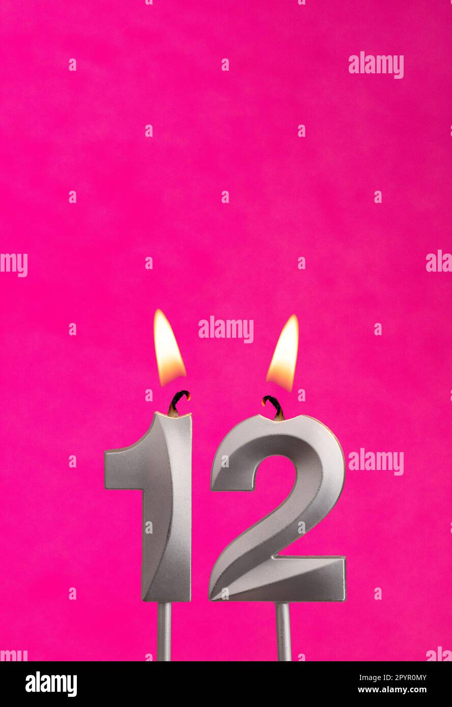 Number 12 candle - Birthday celebration on fuchsia background Stock ...