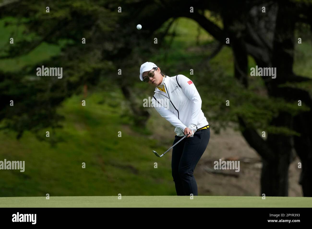 China's Xiyu Lin hits toward the 11th green at the International Crown ...