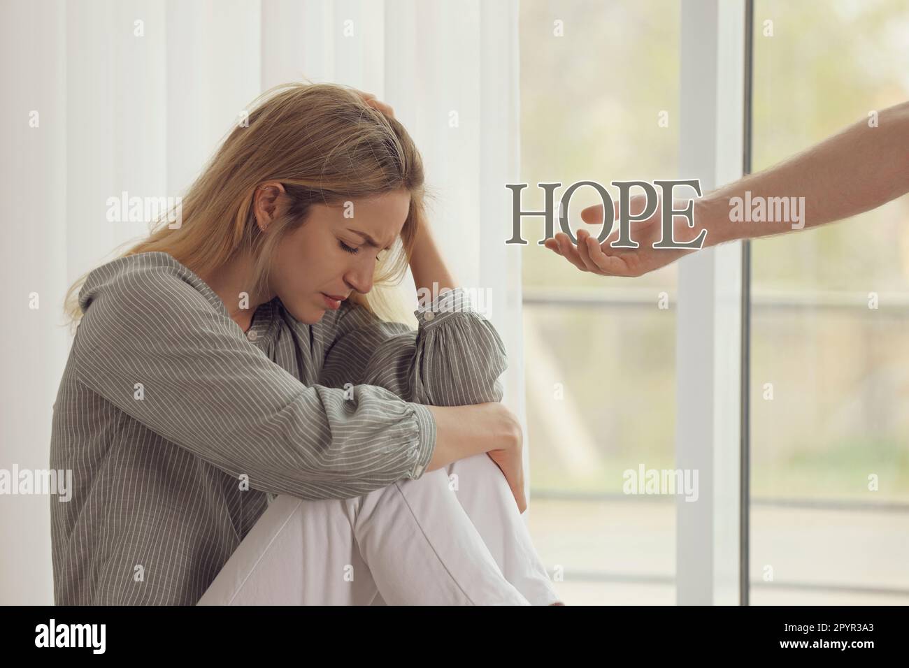 Woman offering help man sitting hi-res stock photography and images - Alamy