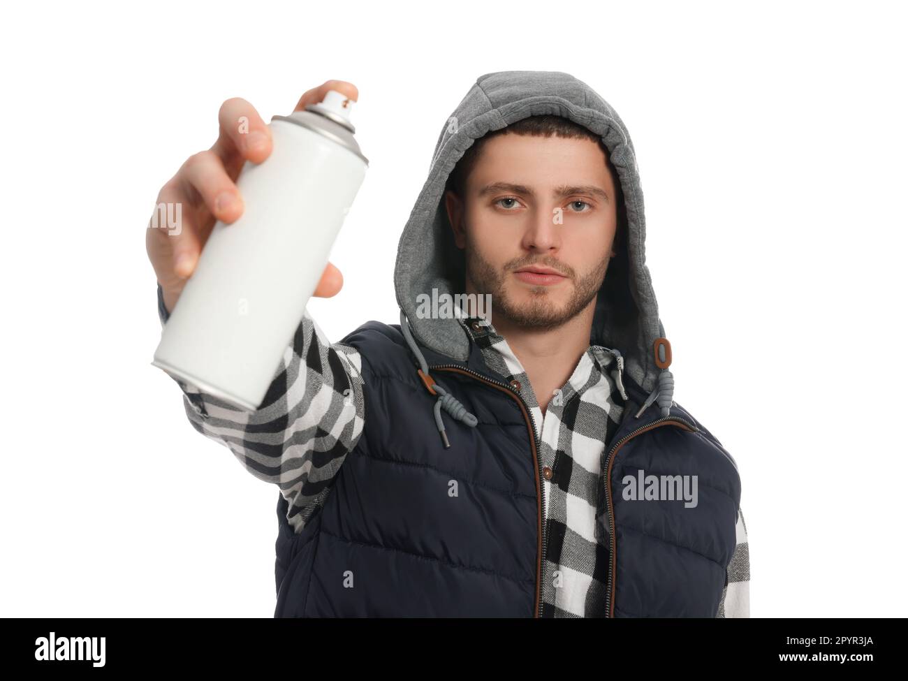 Handsome man holding can of spray paint on white background Stock Photo ...