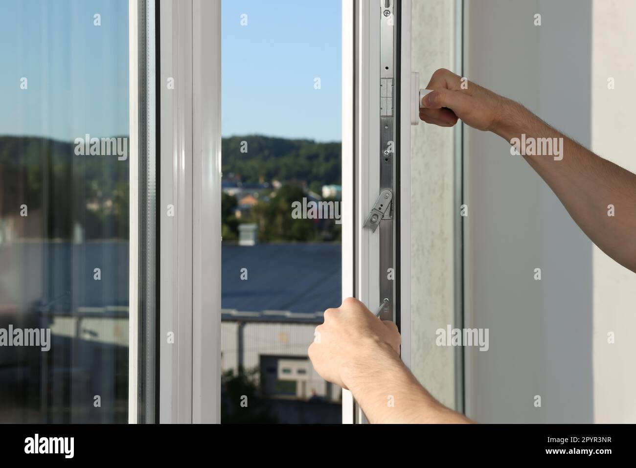 Worker installing plastic window indoors, closeup view Stock Photo - Alamy