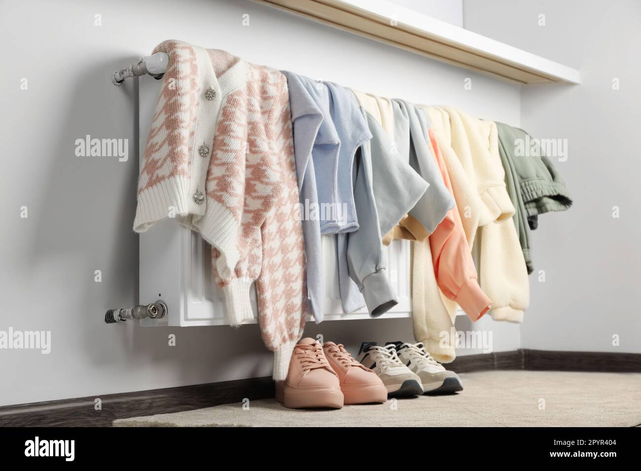 Clothes drying radiator hi-res stock photography and images - Alamy
