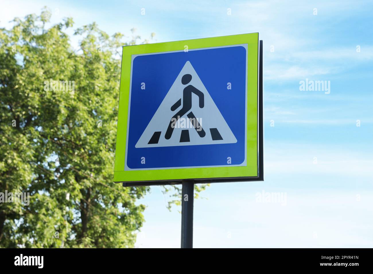 traffic sign Pedestrian Crossing against blue sky Stock Photo - Alamy