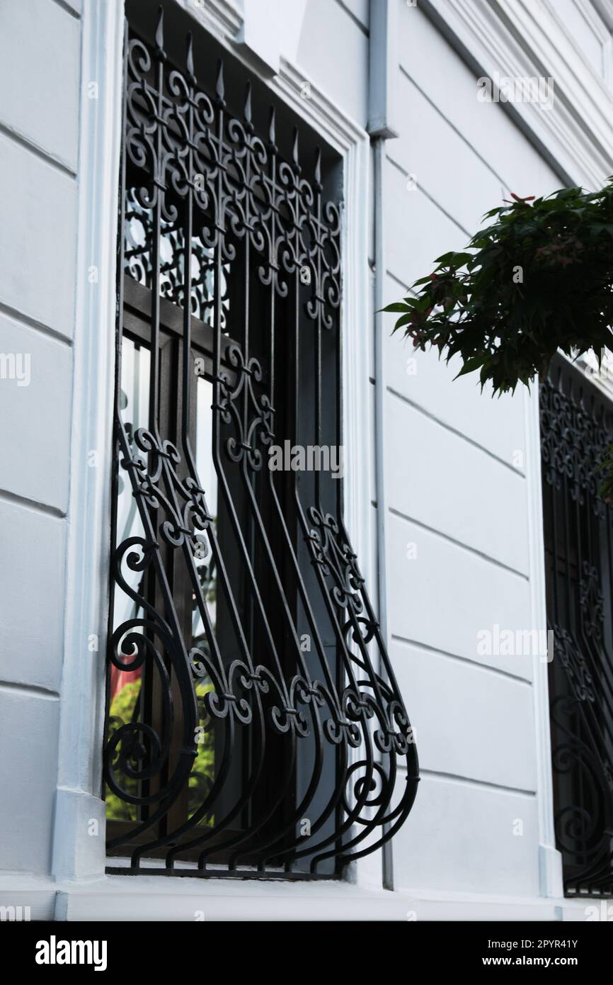 Beautiful window with grills in building outdoors Stock Photo - Alamy