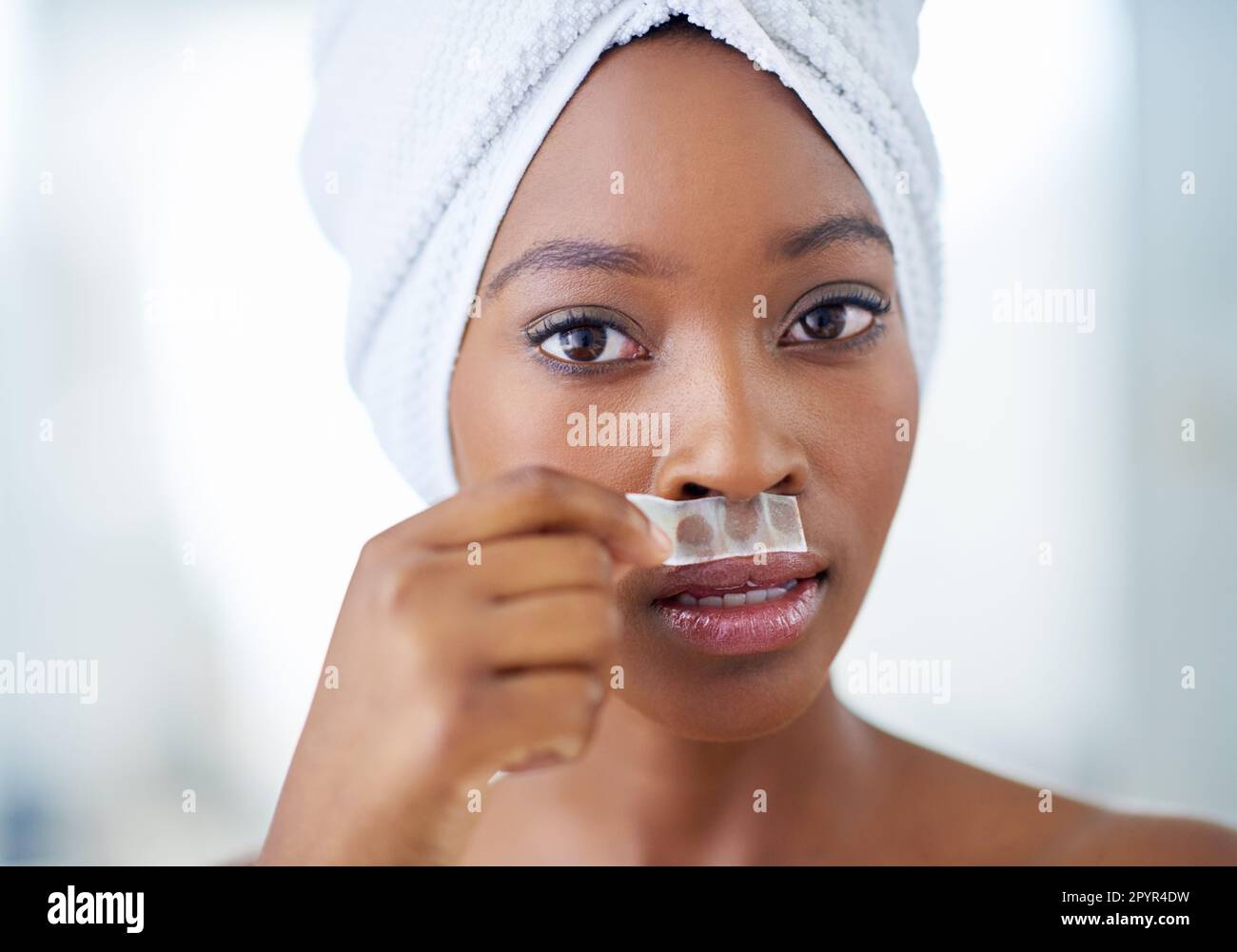 Stay smoother for longer. a beautiful young woman during her daily ...