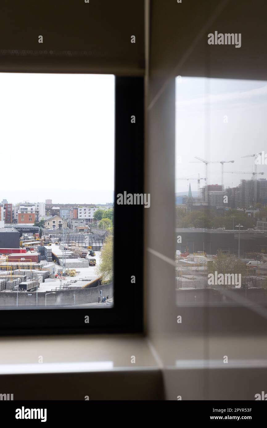 View of Dublin, Ireland through a window, reflected against a wall ...