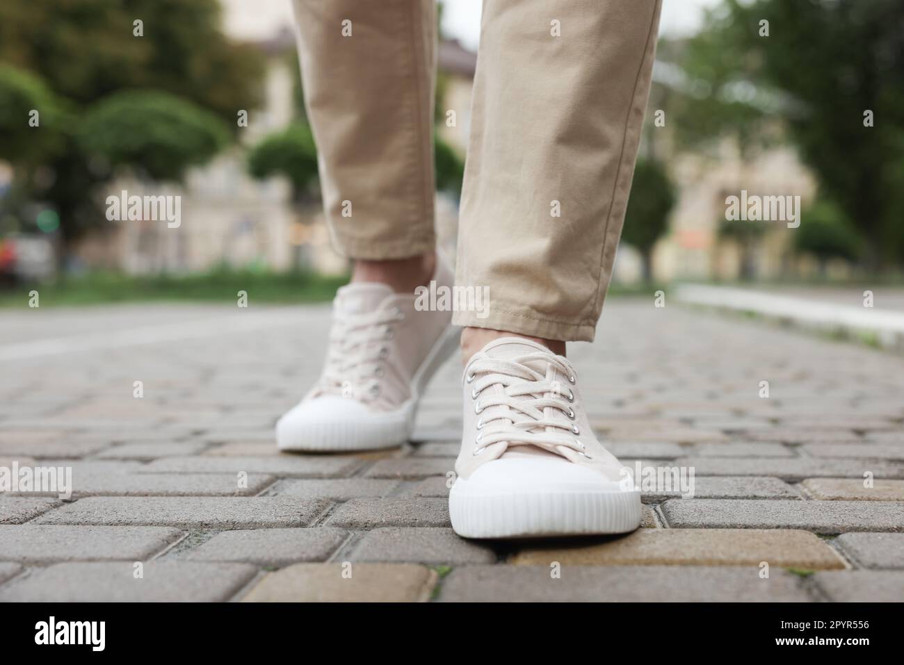 Man walking on paving hi-res stock photography and images - Alamy