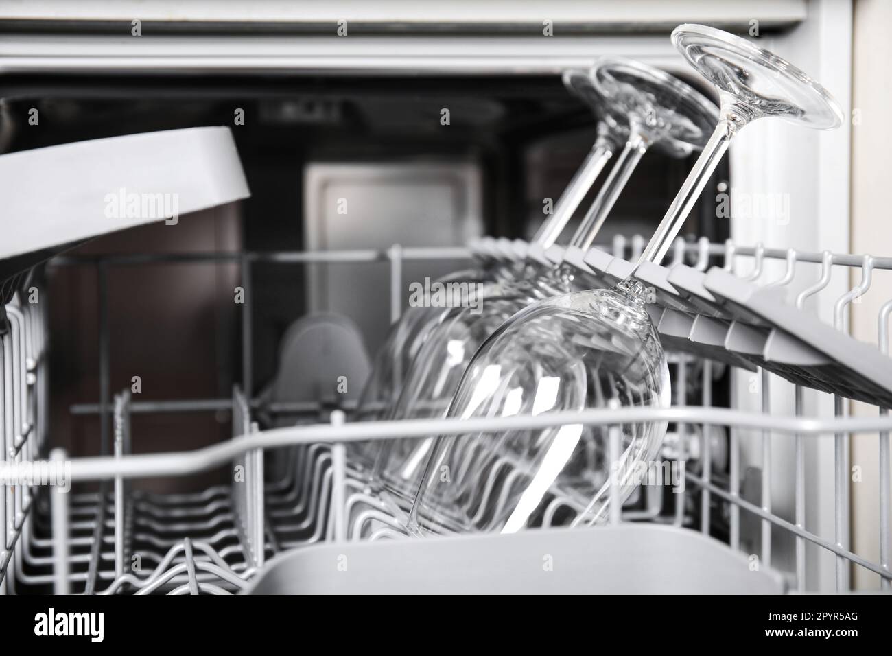 Open clean dishwasher with glasses, closeup. Home appliance Stock Photo ...