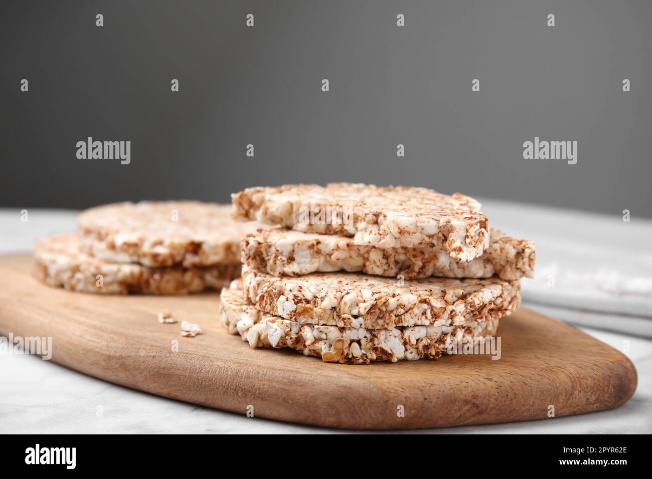 Crunchy buckwheat cakes on wooden board, closeup Stock Photo - Alamy