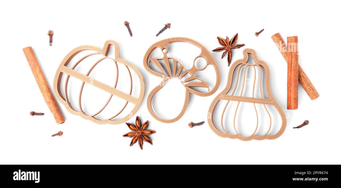 Different cookie cutters and spices on white background, top view Stock ...