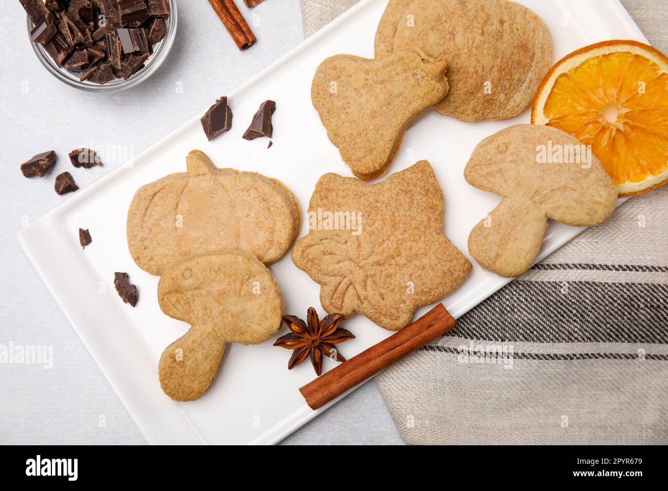 Flat lay composition with baked biscuits of different shapes on light ...
