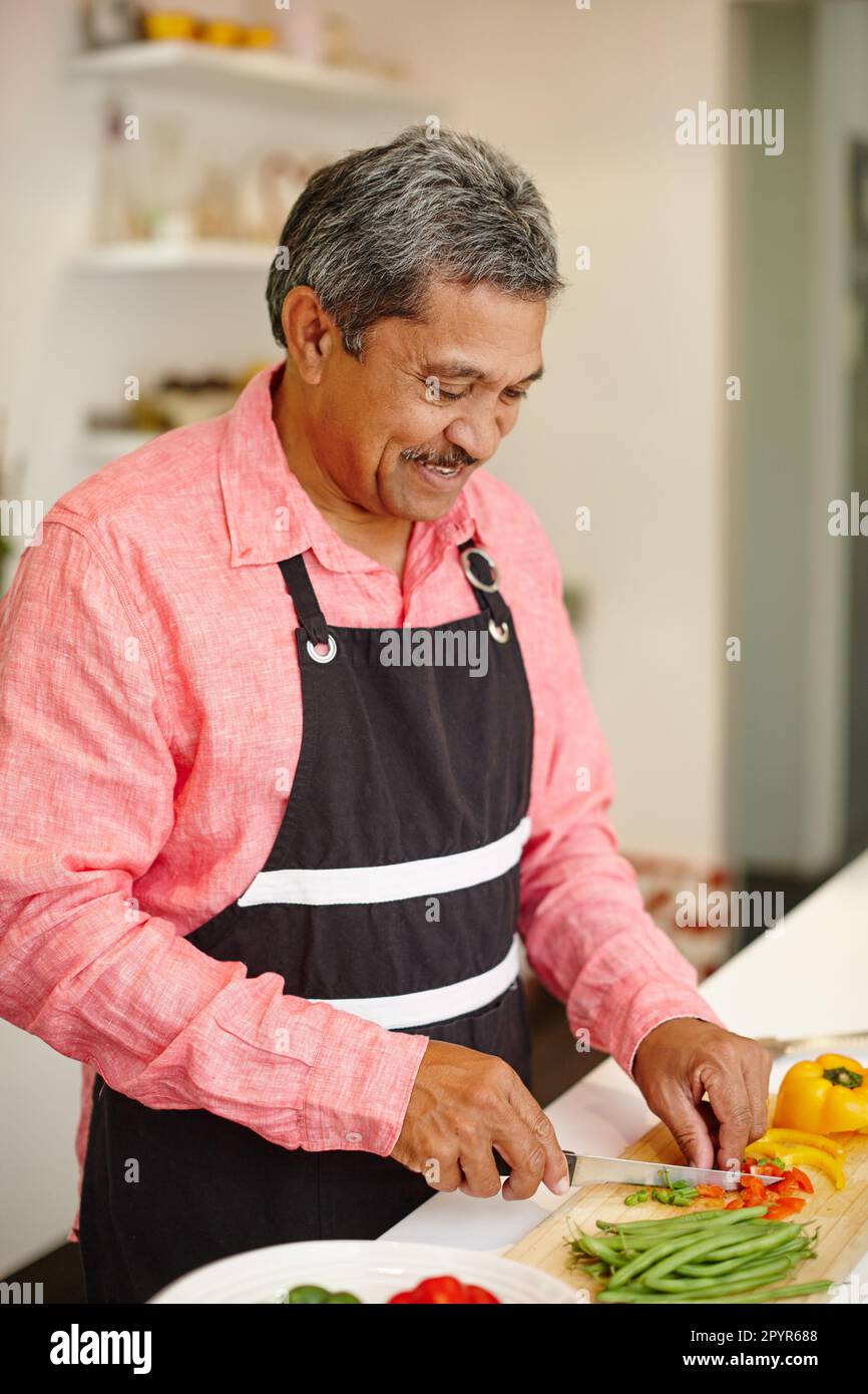 About to whip up something healthy and tasty. a happy senior man ...