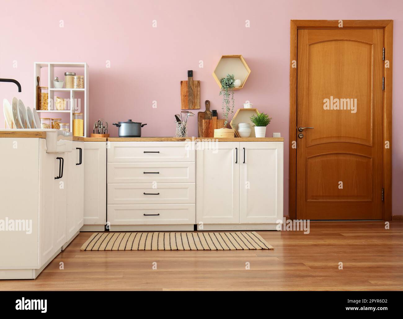 Interior of stylish kitchen with white counters Stock Photo - Alamy