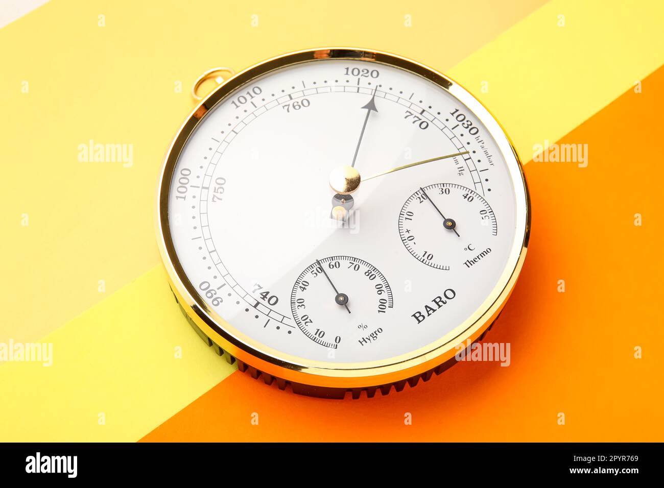 Aneroid barometer on colorful background Stock Photo - Alamy