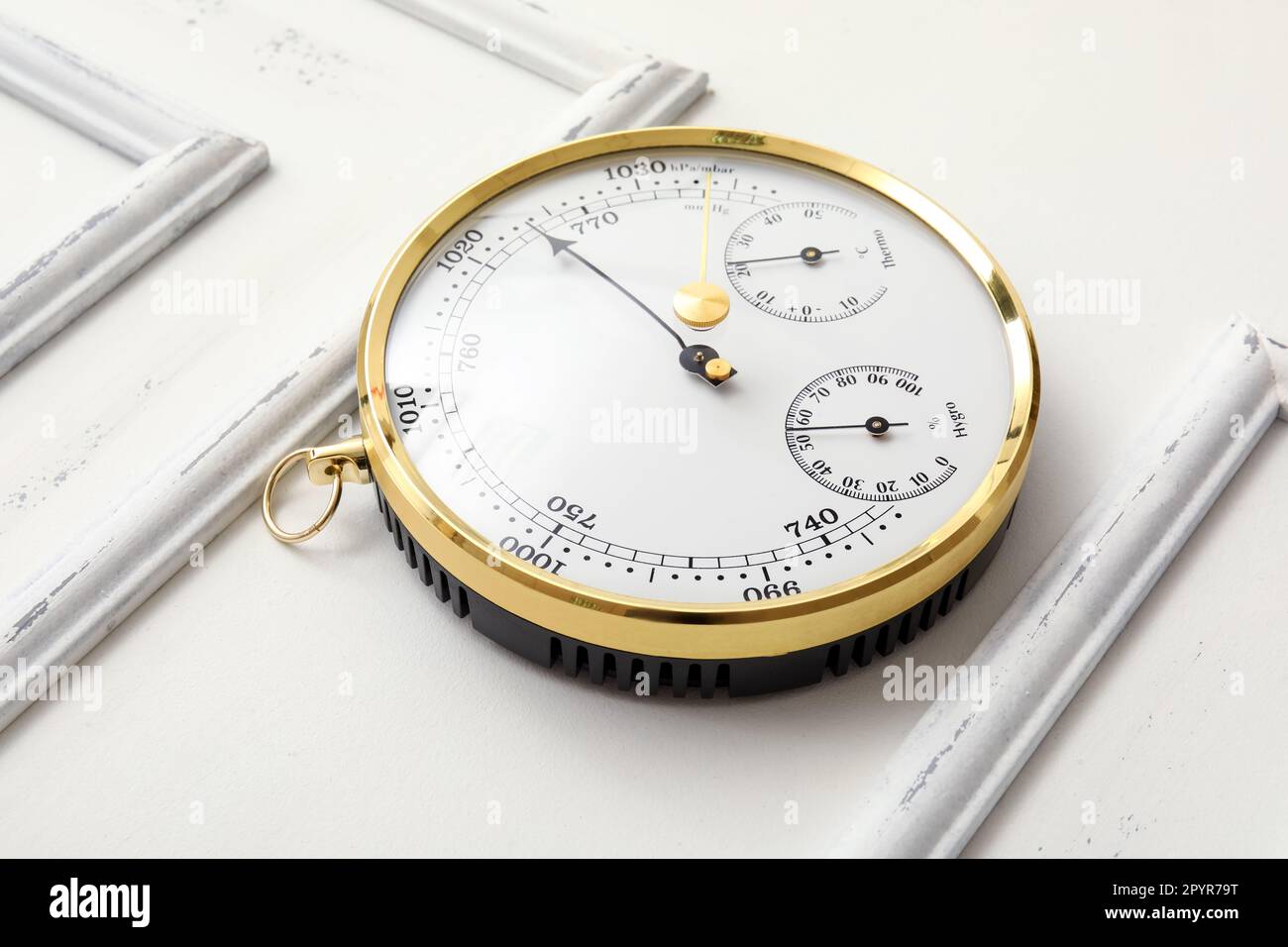 Aneroid barometer on white wooden background Stock Photo - Alamy