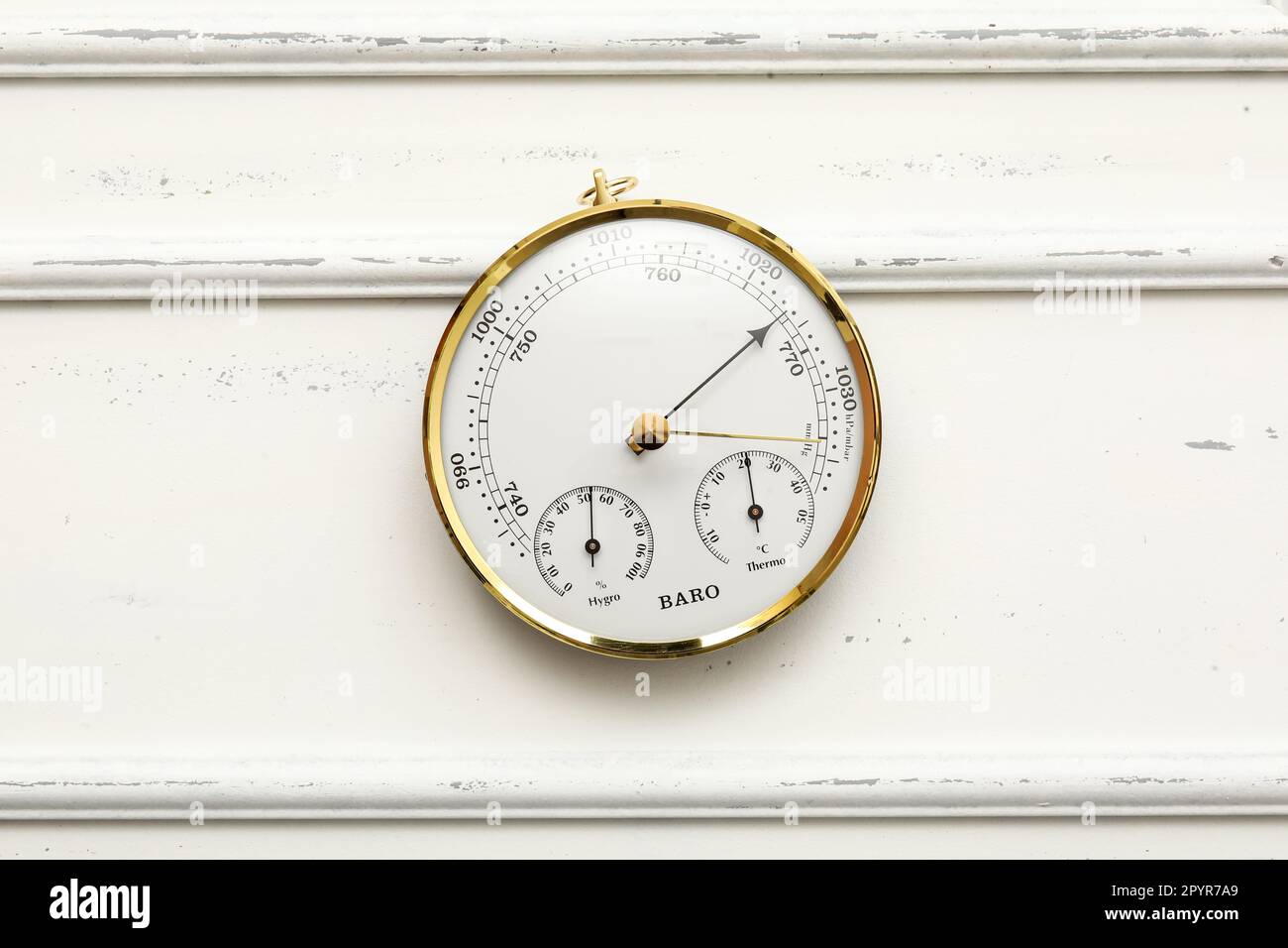 Aneroid barometer on white wooden background Stock Photo - Alamy