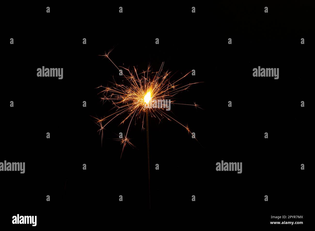 One burning sparkler stick on black background Stock Photo - Alamy