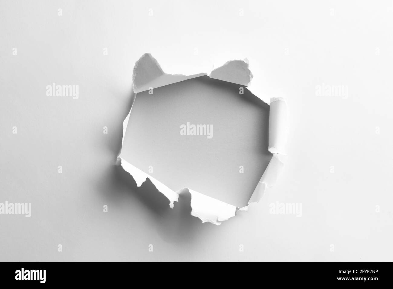 Round hole in paper Black and White Stock Photos & Images - Alamy