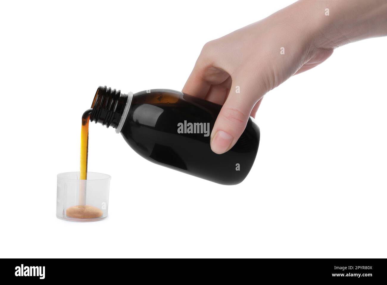 Woman pouring syrup into measuring cup from bottle isolated on white ...