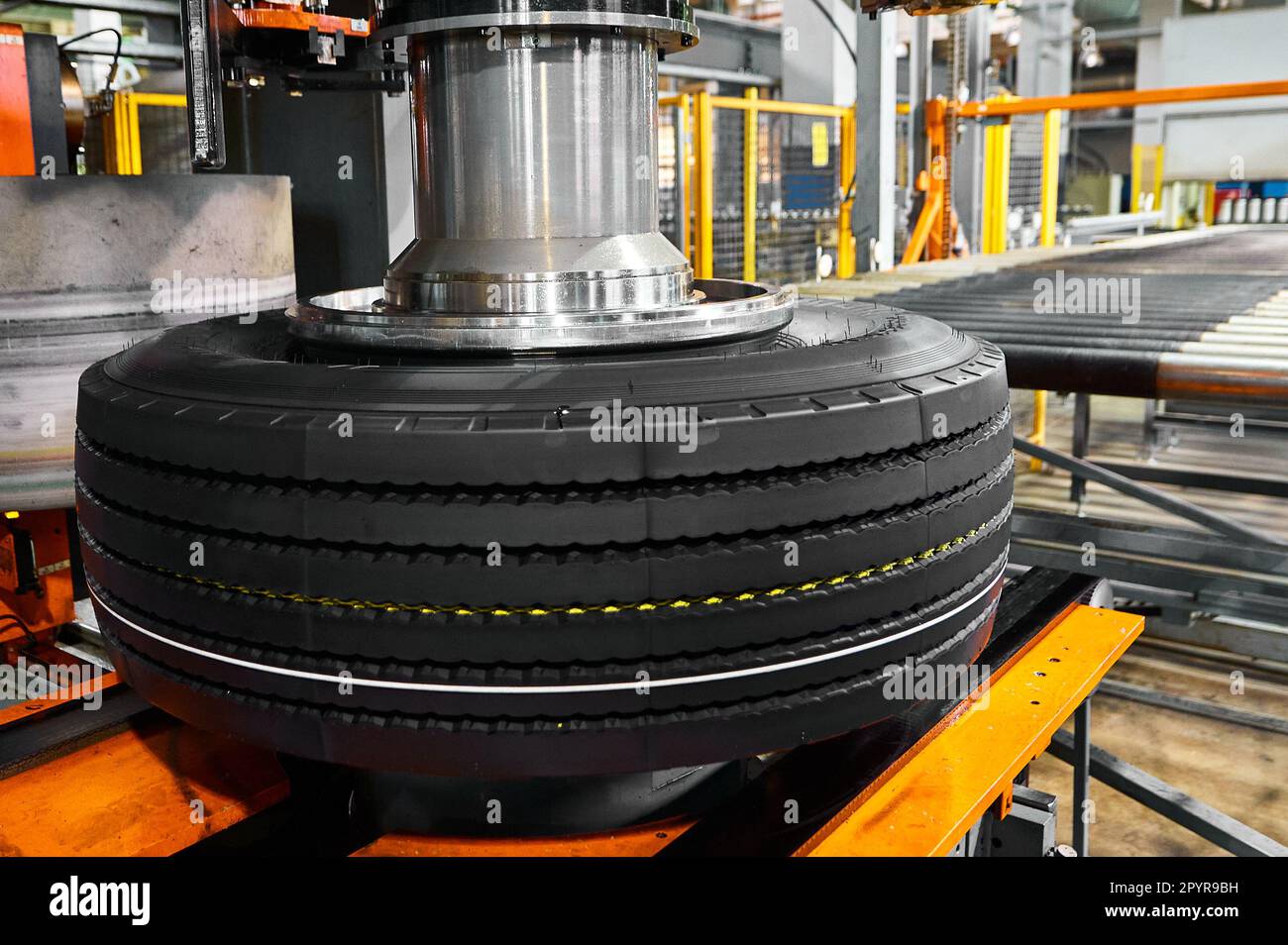 Tire with deep protector and marking on conveyor at plant Stock Photo ...