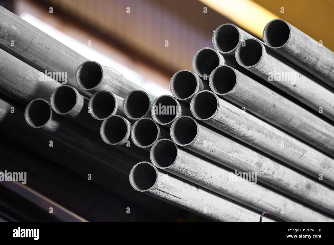 Stack of cold rolled tubes in industrial complex storage Stock Photo ...