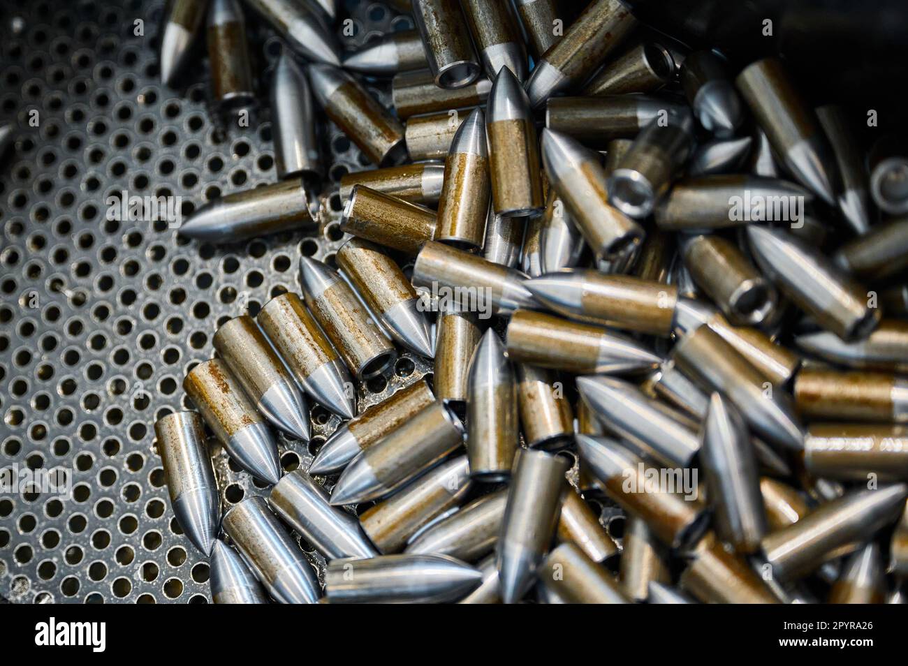 Scattered grey bullets armour ammunition as background Stock Photo - Alamy