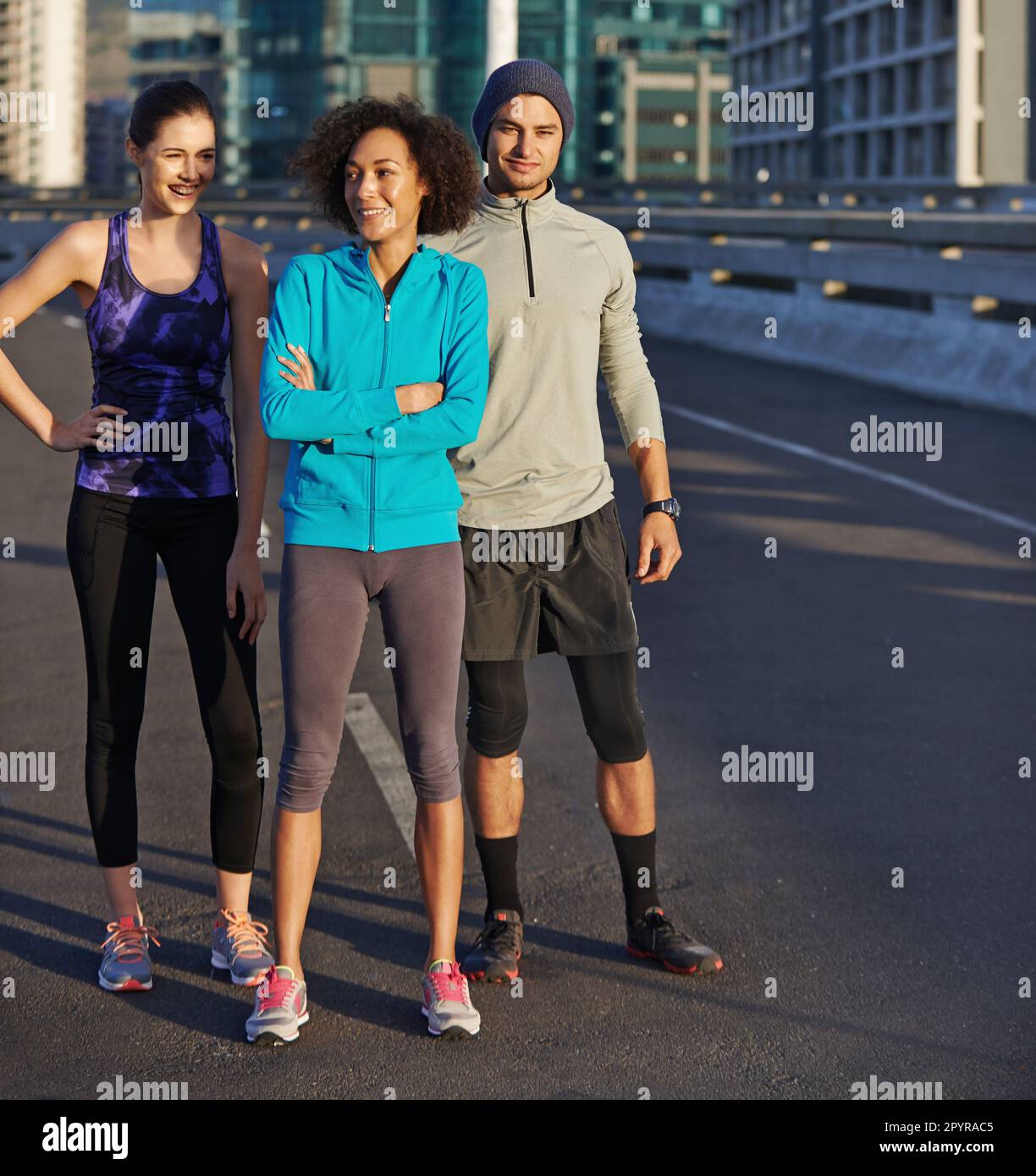 The fantasitc three of jogging. three young joggers standing in an ...
