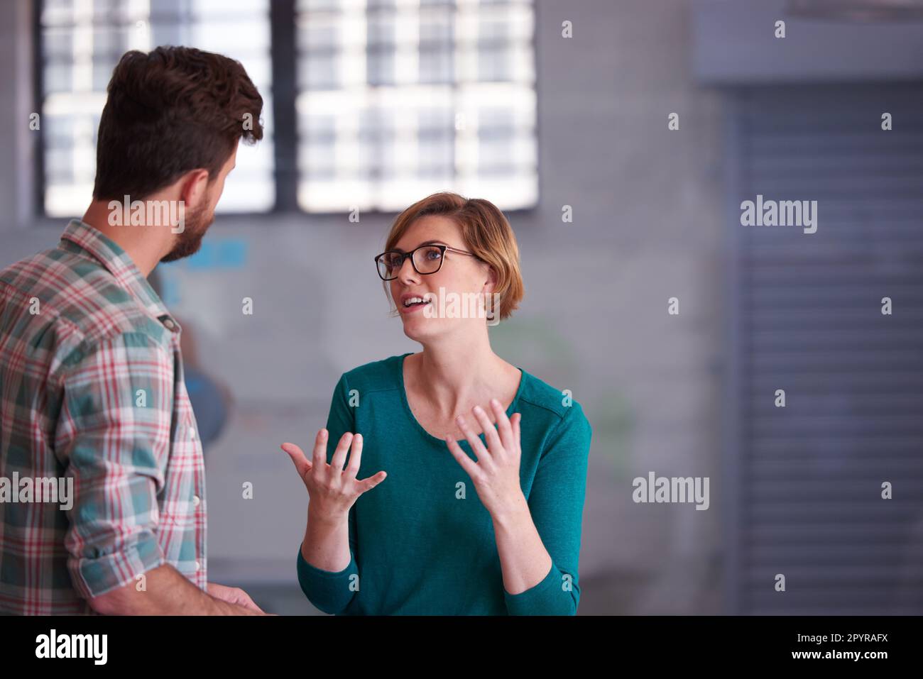 Teamwork makes the dream work. a group of young creatives talking ...