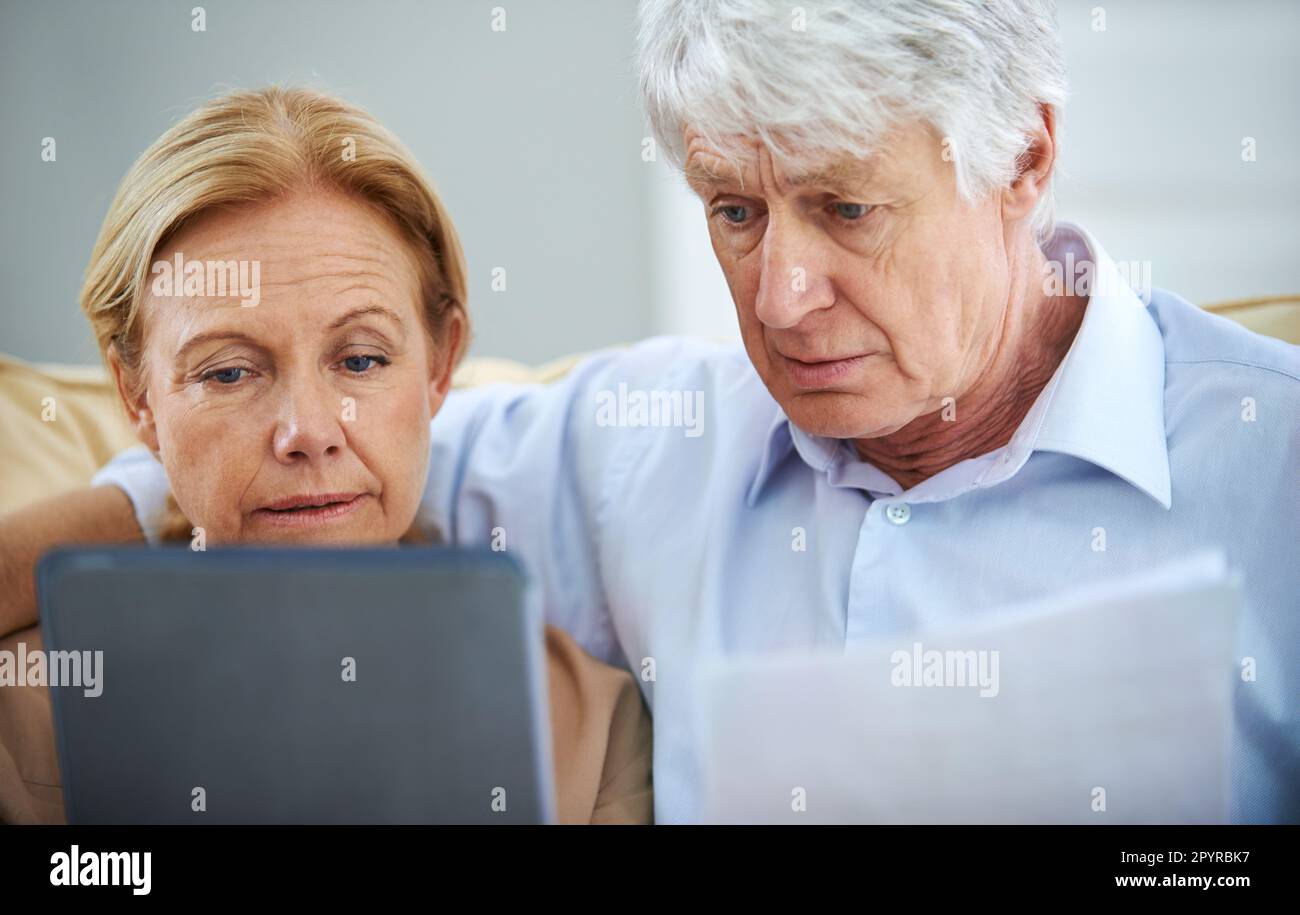 Carefully considering all of their options. an elderly couple going ... Carefully considering all of their options. an elderly couple going ...