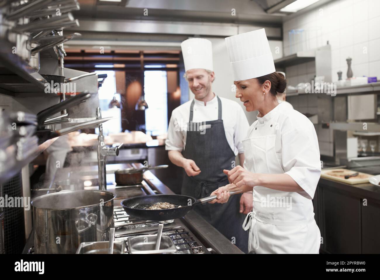 Cooking is an art. the inner working of a professional kitchen Stock ...