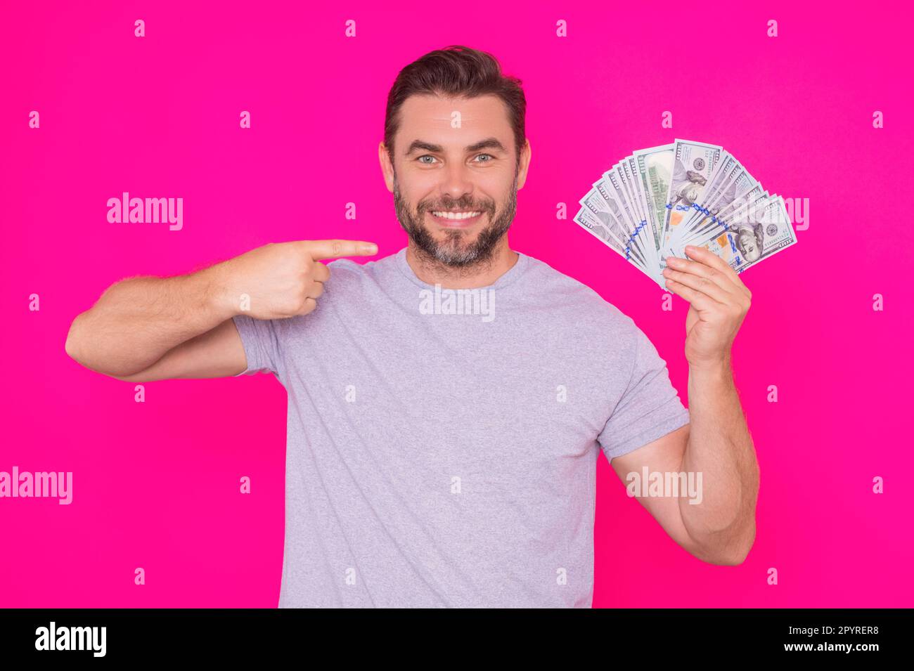 Man with money cash. Dollar banknotes. Portrait of man holding bunch of ...