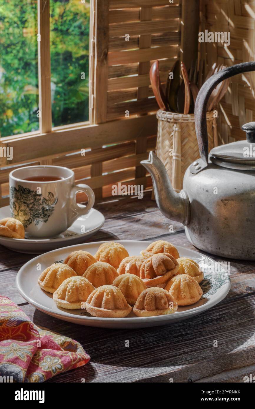 Malaysian traditional sweet sponge cake called Kuih Bahulu or Bolu on a ...