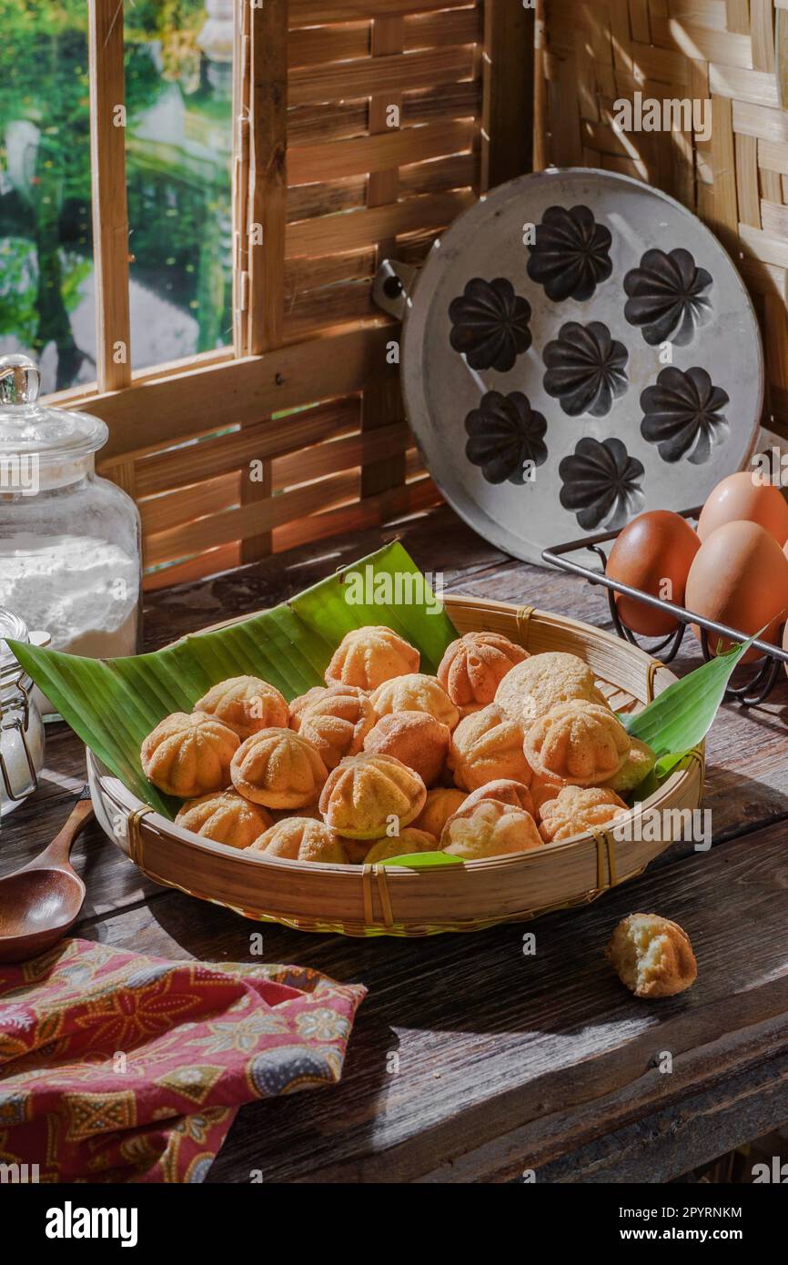 Malaysian traditional sweet sponge cake called Kuih Bahulu or bolu on a ...