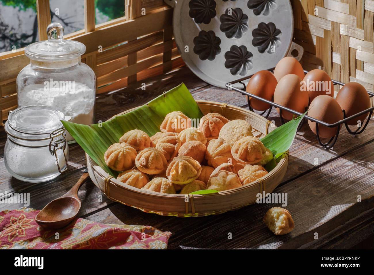 Malaysian traditional sweet sponge cake called Kuih Bahulu or bolu on a ...