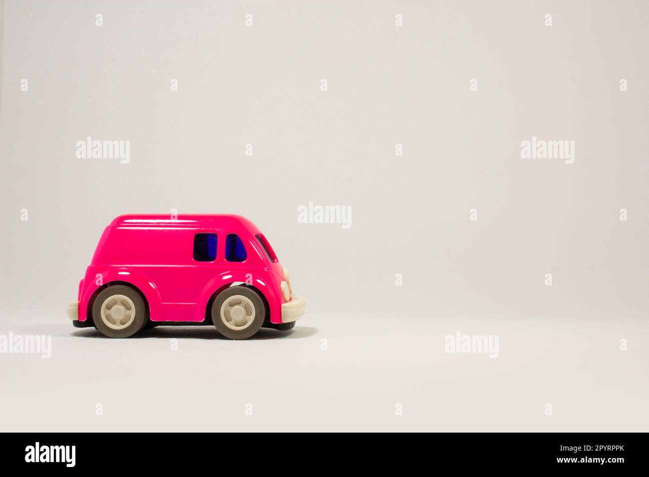 die cast models pink color on white background Stock Photo - Alamy