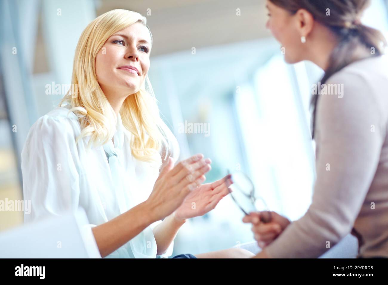 Explaining her ideas. Two corporate women in discussion at the office ...