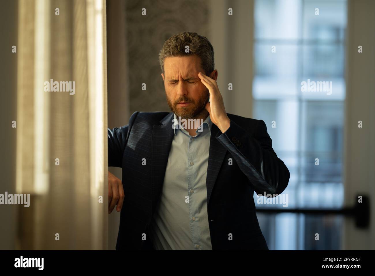 Tired man feel pain head. Close up portrait of stressed man suffer from ...