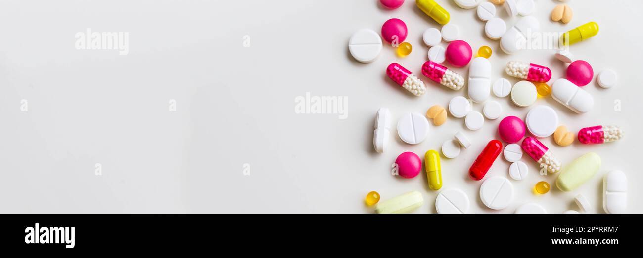 Frame of colorful antibiotic capsule pills. Pile of antibiotic capsule ...