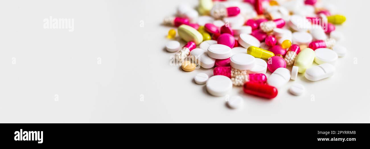 Frame of colorful antibiotic capsule pills. Pile of antibiotic capsule ...