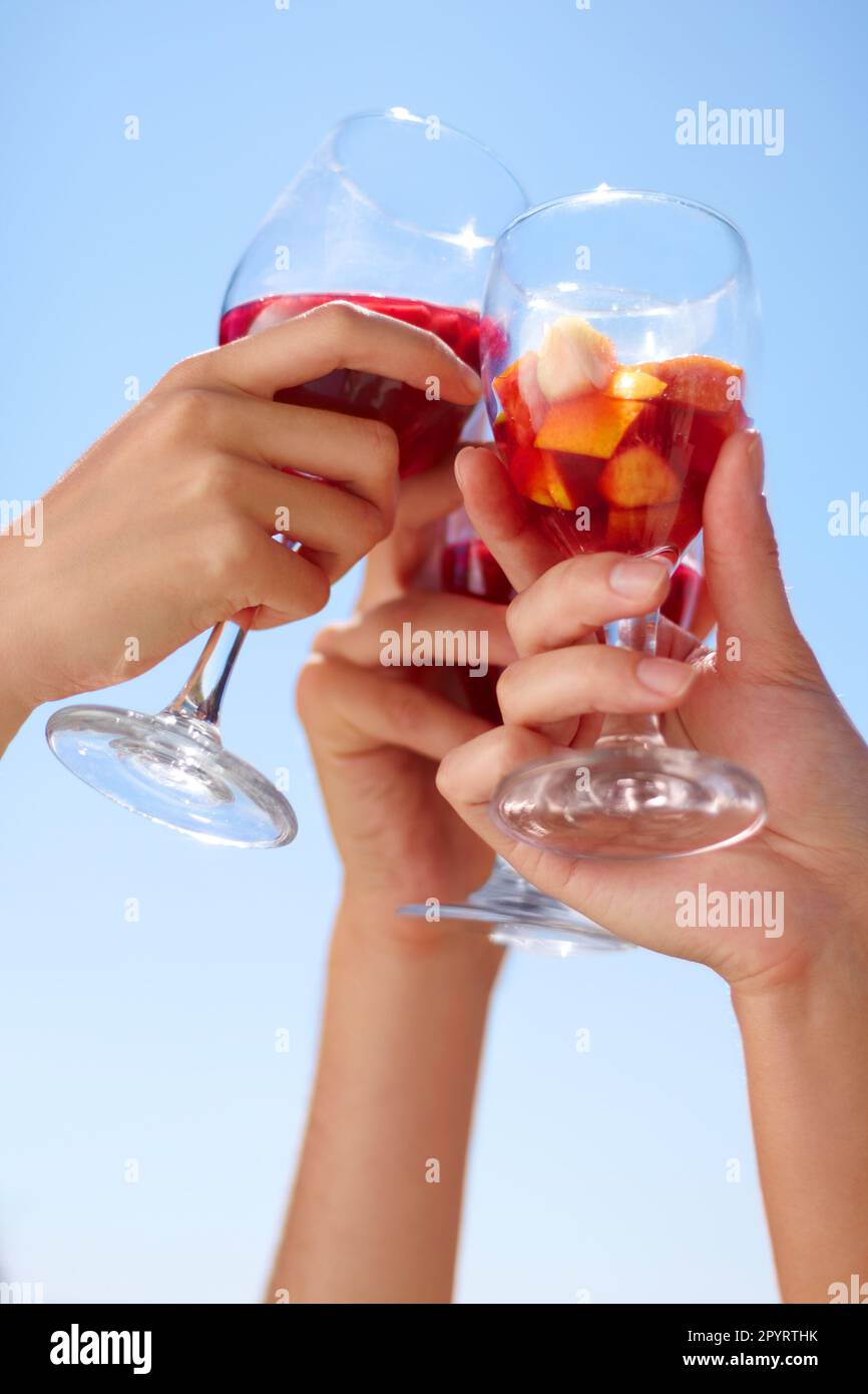 Hands, cocktail toast and friends outdoor for celebration of friendship ...