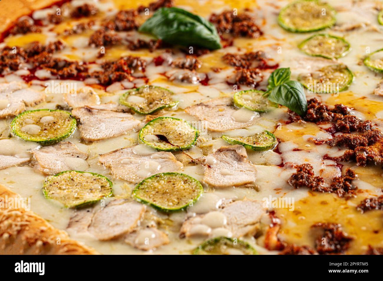Big assorted pizza with variety of toppings Stock Photo - Alamy