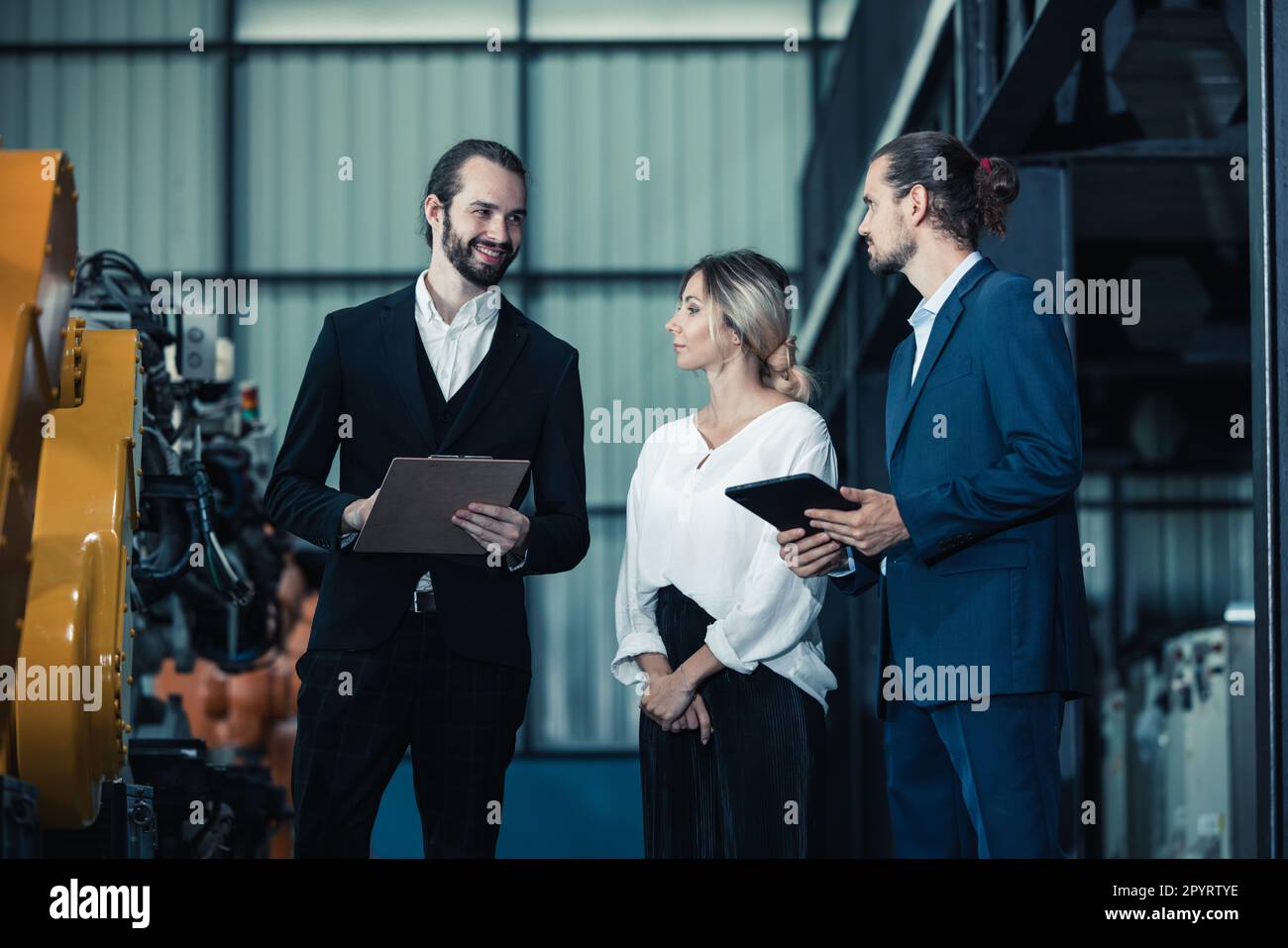 Robotic factory owner explain, discuss functionality and performance of robot systems with ...