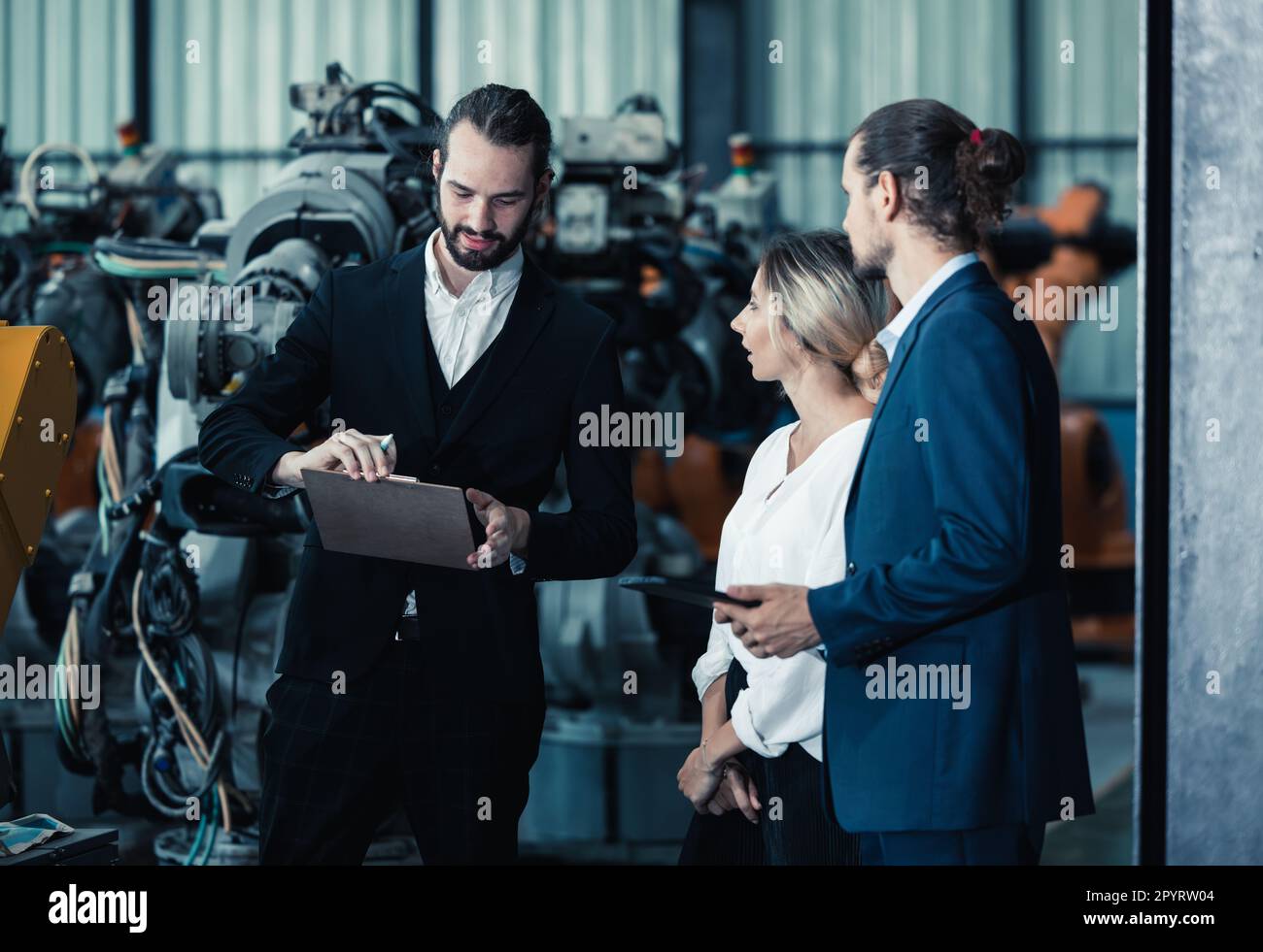 Robotic factory owner explain, discuss functionality and performance of robot systems with ...