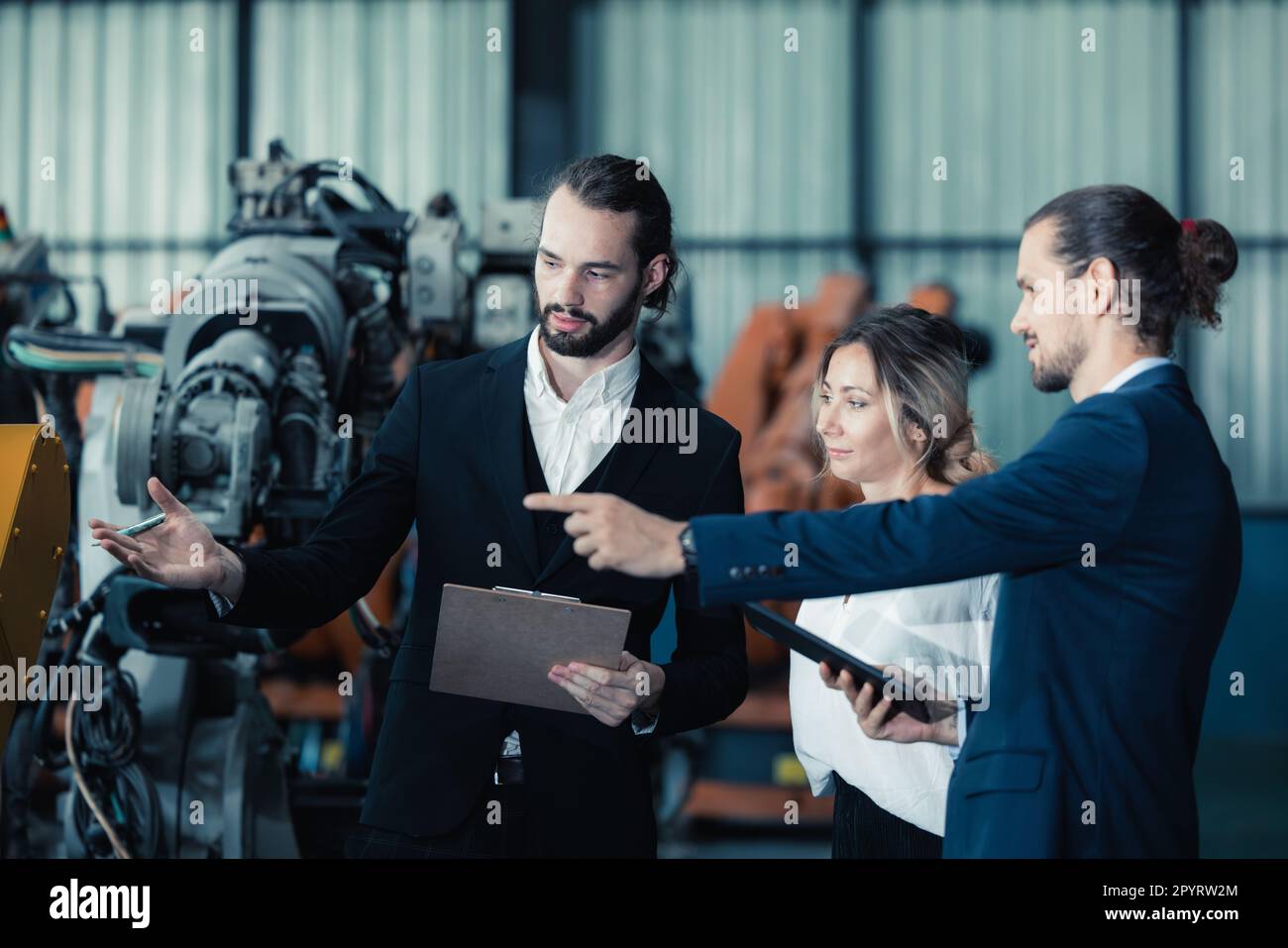 Robotic factory owner explain, discuss functionality and performance of robot systems with ...