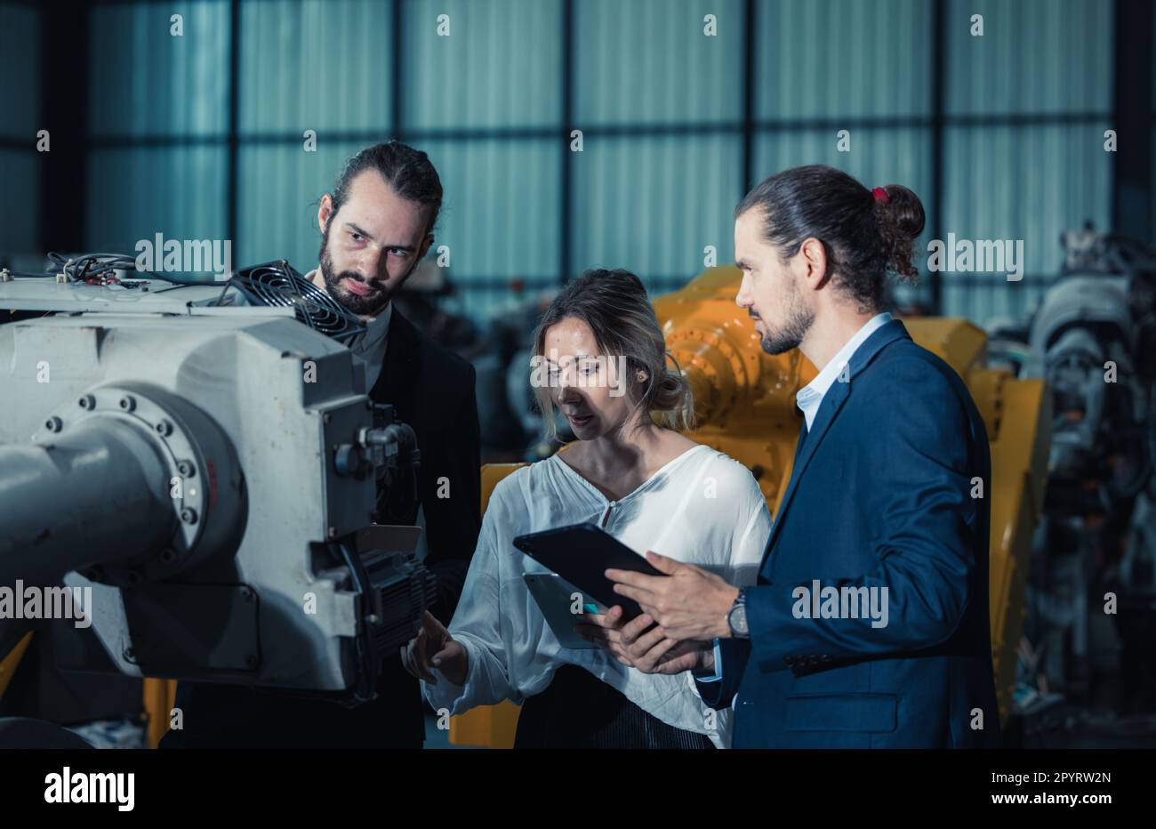 Robotic factory owner explain, discuss functionality and performance of robot systems with ...