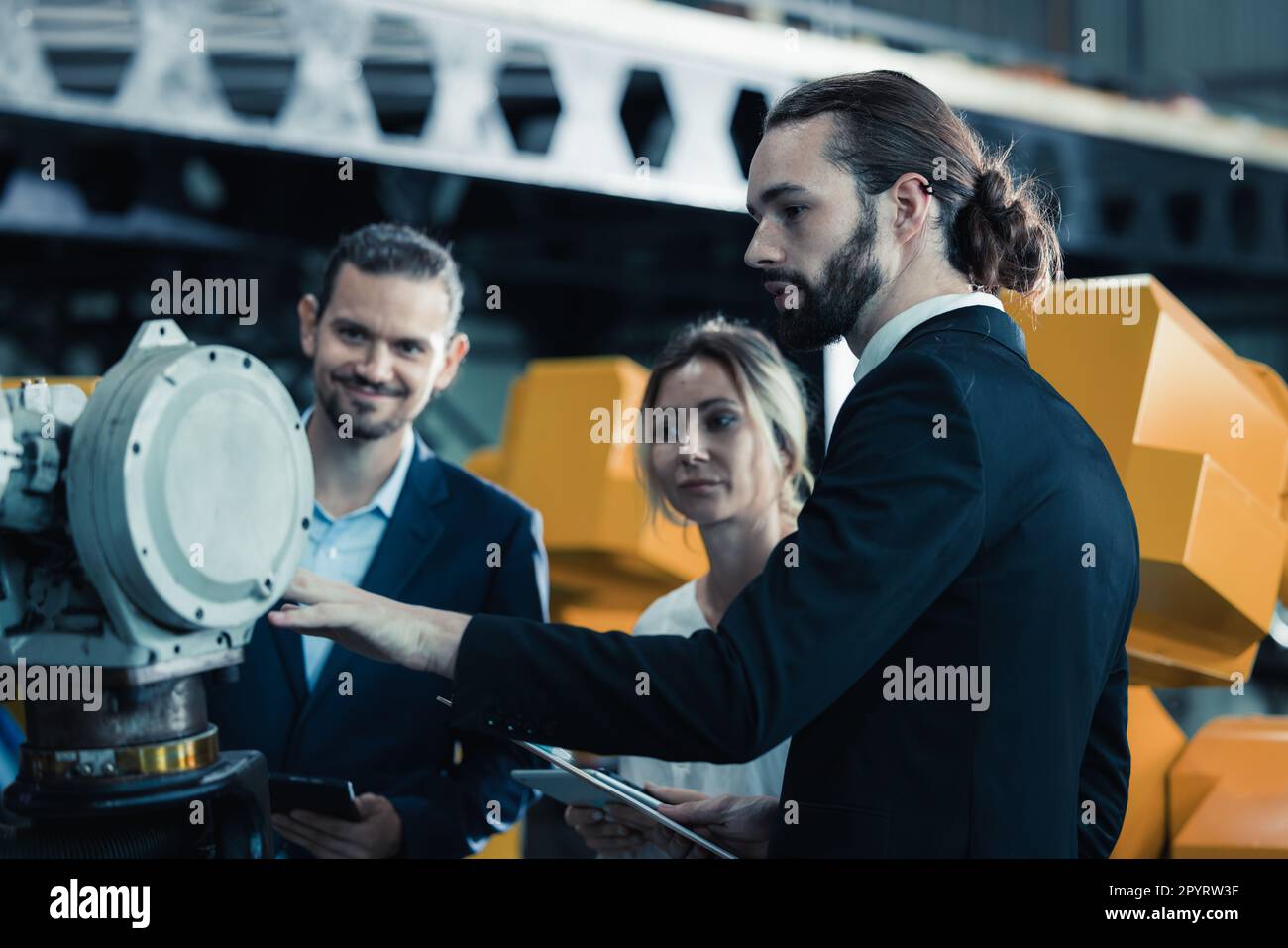 Robotic factory owner explain, discuss functionality and performance of robot systems with ...