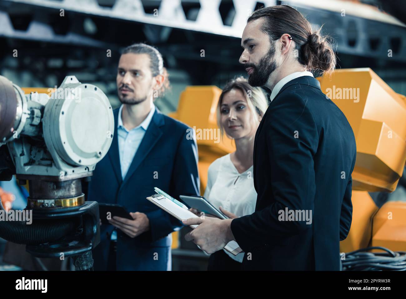 Robotic factory owner explain, discuss functionality and performance of robot systems with ...