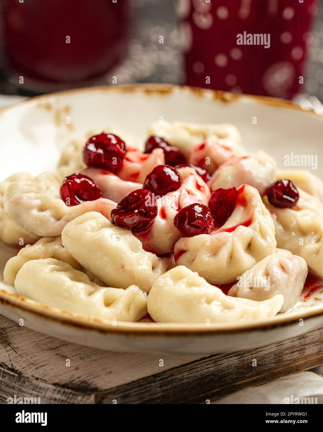 Portion of russian dumplings vareniki with cherry Stock Photo - Alamy