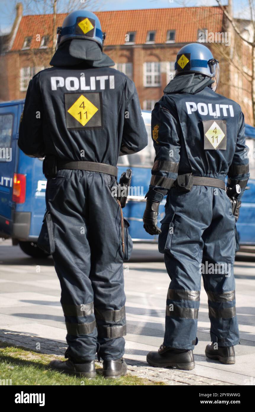 Security, riot and protest with police officer in city for law ...