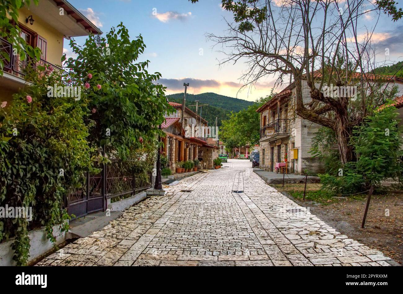 Street with houses in Zarouhla village in Greece. Aroania mountain ...